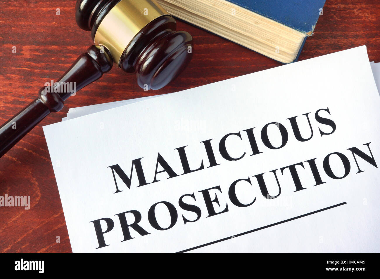Malicious prosecution and gavel on a table Stock Photo - Alamy