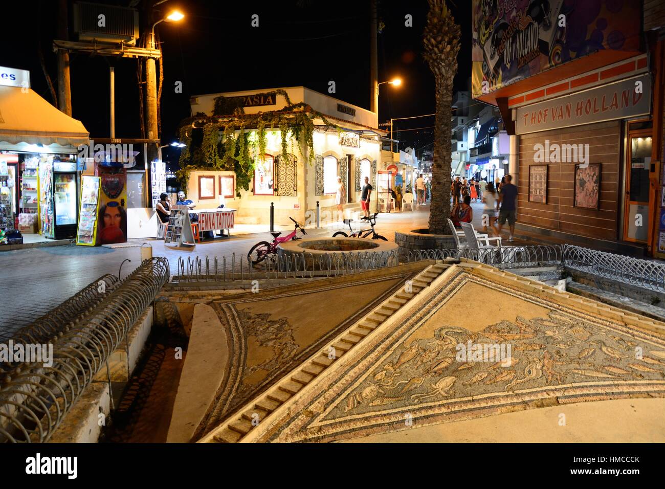 View of the Roman Sarakino fountain along the waterfront at night with ...