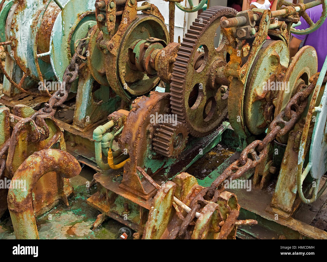 Rusting anchor winch gear system on the deck of a ferry in Southeast ...