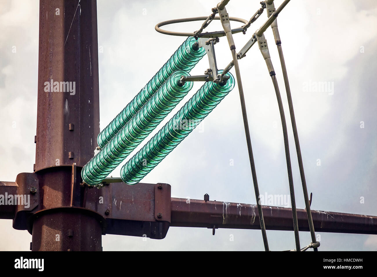 Aqua colored glass power line insulators Stock Photo - Alamy
