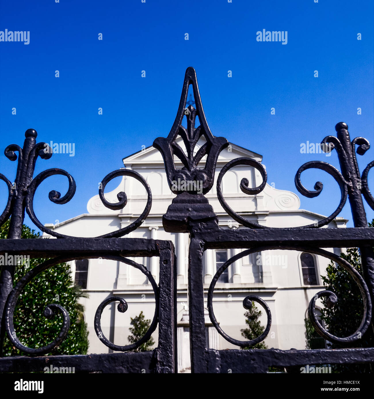 Iron fence behind St. Louis Catedral that surrounds a gardens of the ...
