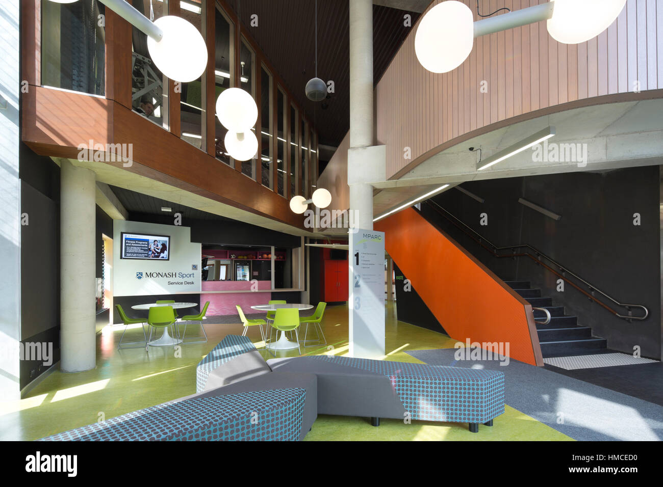 Entrance foyer with reception desk in background & gymnasium volume ...