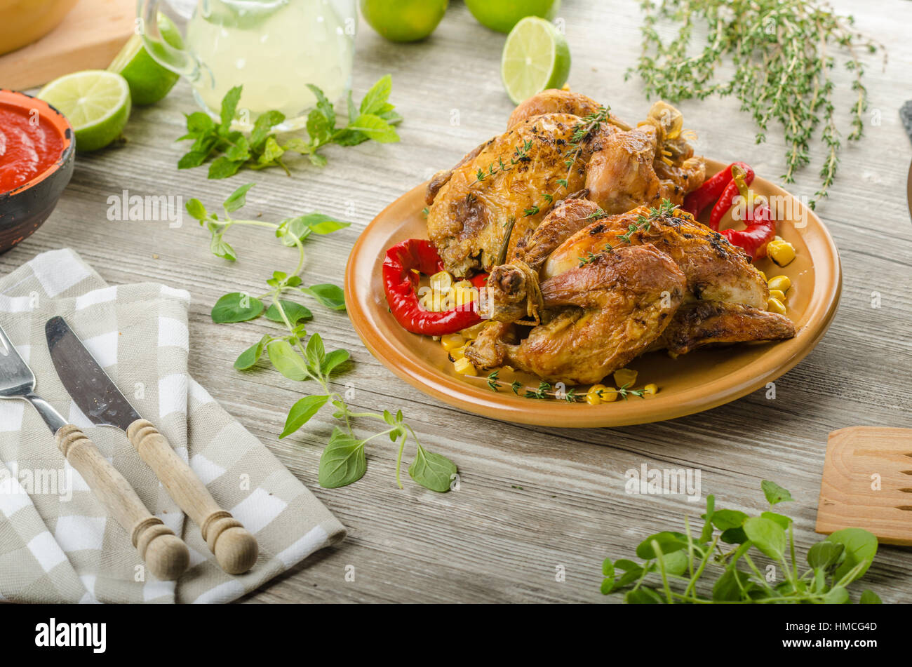Dinner table with grilled mini chicken hi-res stock photography and ...