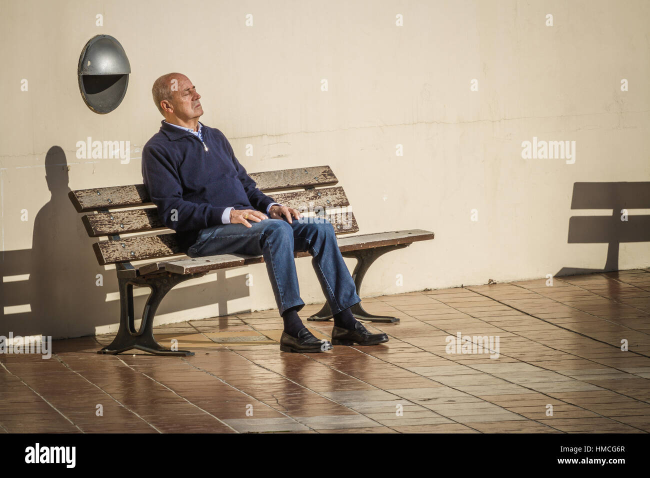 Old man sunbathing hi-res stock photography and images - Alamy