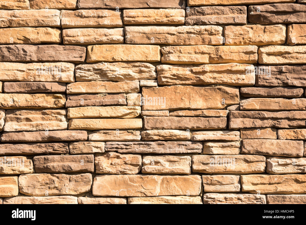 Stone wall background captured from a closeup of a natural stone ...