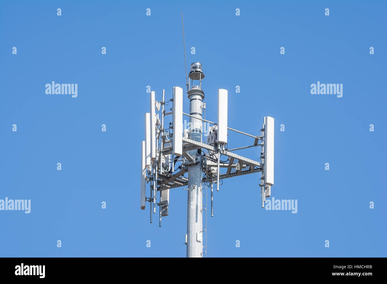 A telecommunications tower isolated on blue sky background. The tower ...