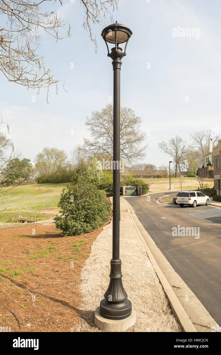 A street light located next to a concrete curb Stock Photo - Alamy