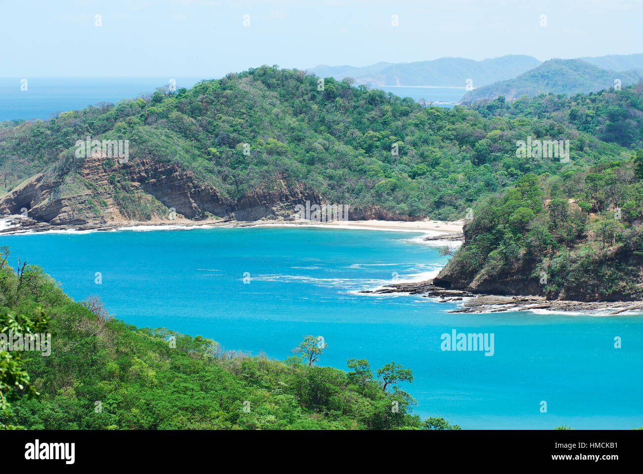 bay with blue sea water and sand on beach Stock Photo - Alamy