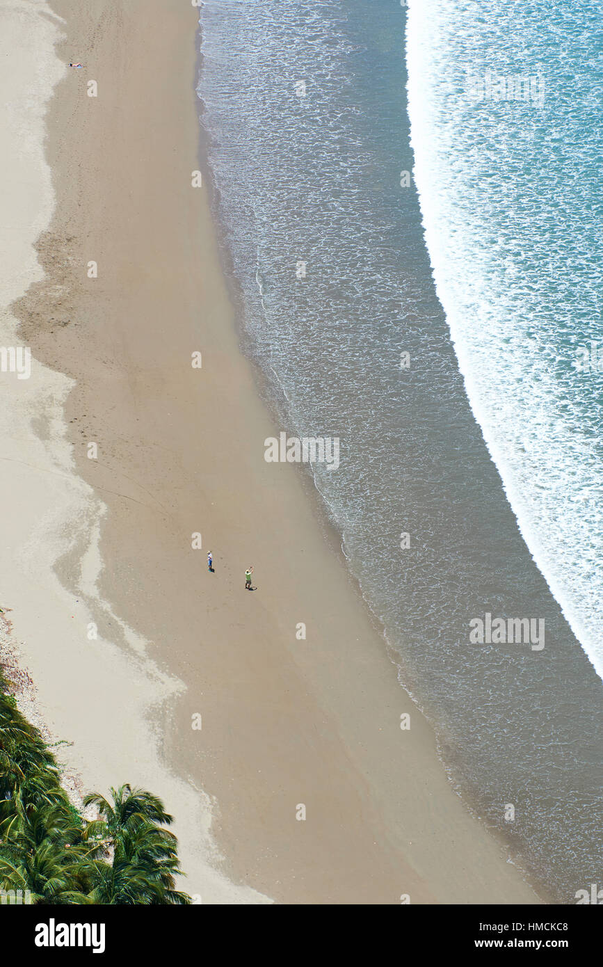 Ariel view on beach with wet sand and big wave Stock Photo - Alamy