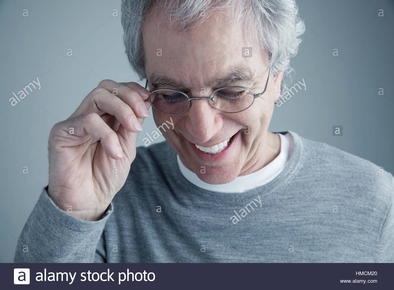 Portrait smiling Caucasian senior man with gray hair and eyeglasses ...