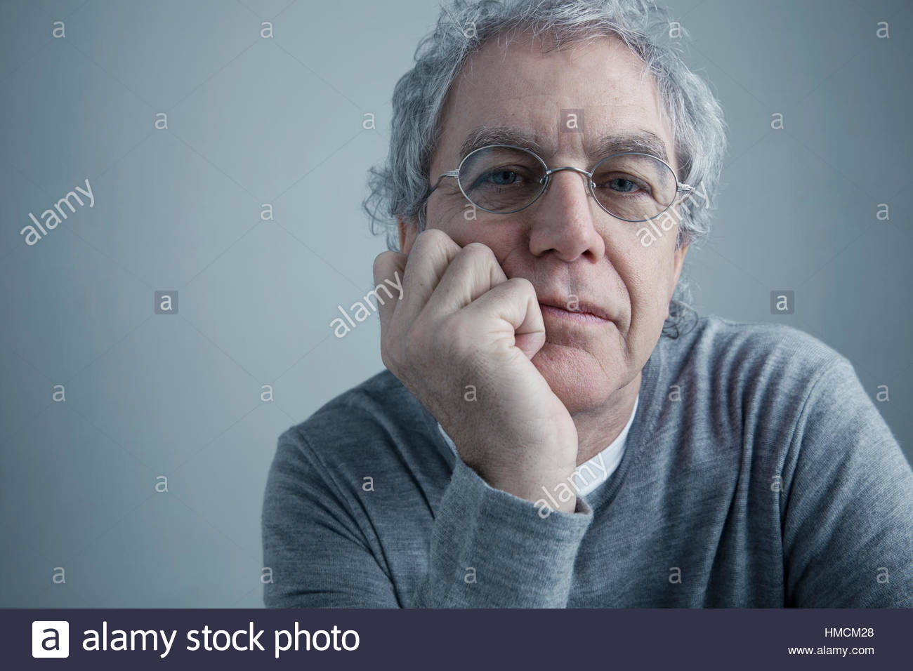 Portrait Serious Caucasian Senior Man With Gray Hair And Eyeglasses