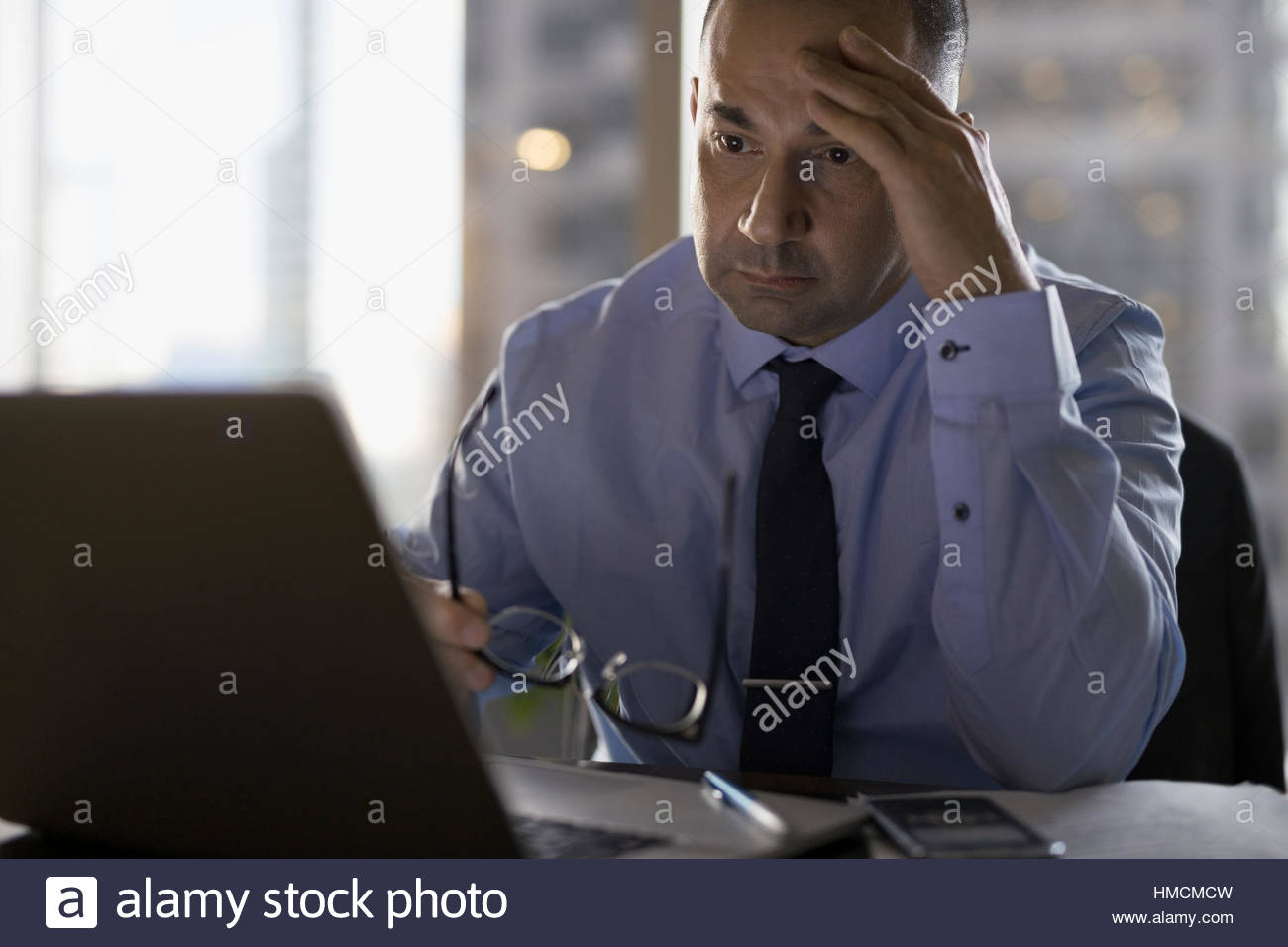 Male working late office desk hi-res stock photography and images - Alamy
