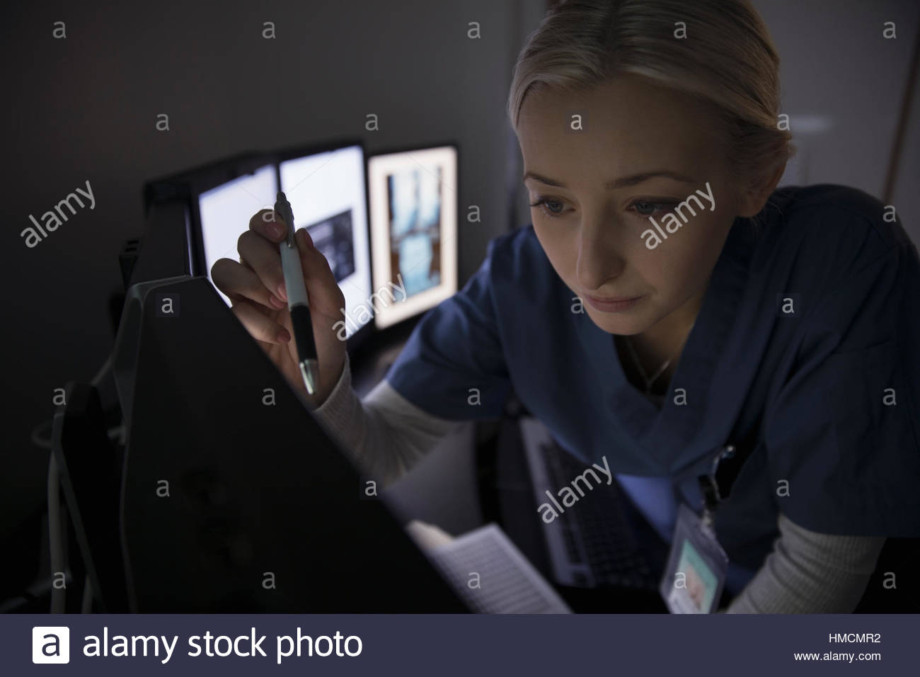 Doctor nurse looking computer monitor hi-res stock photography and ...