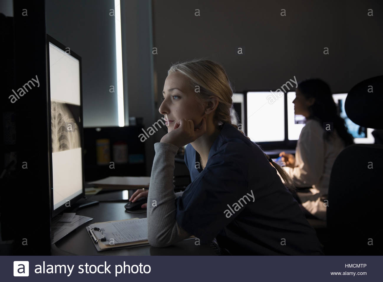 Doctor nurse looking computer monitor hi-res stock photography and ...