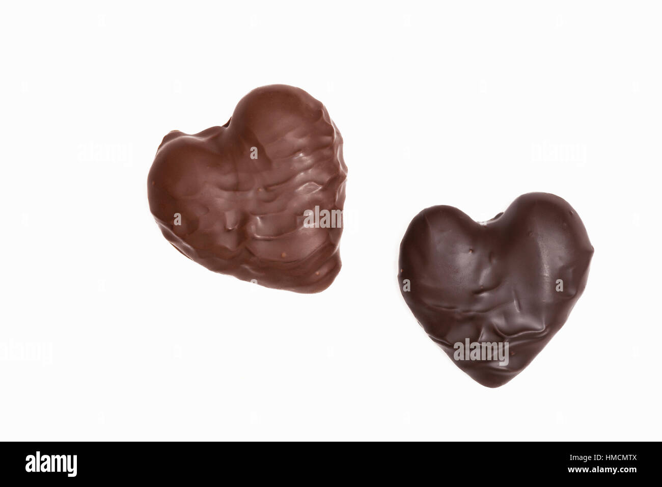 Two heart shaped Chocolates - one milk chocolate the other dark ...