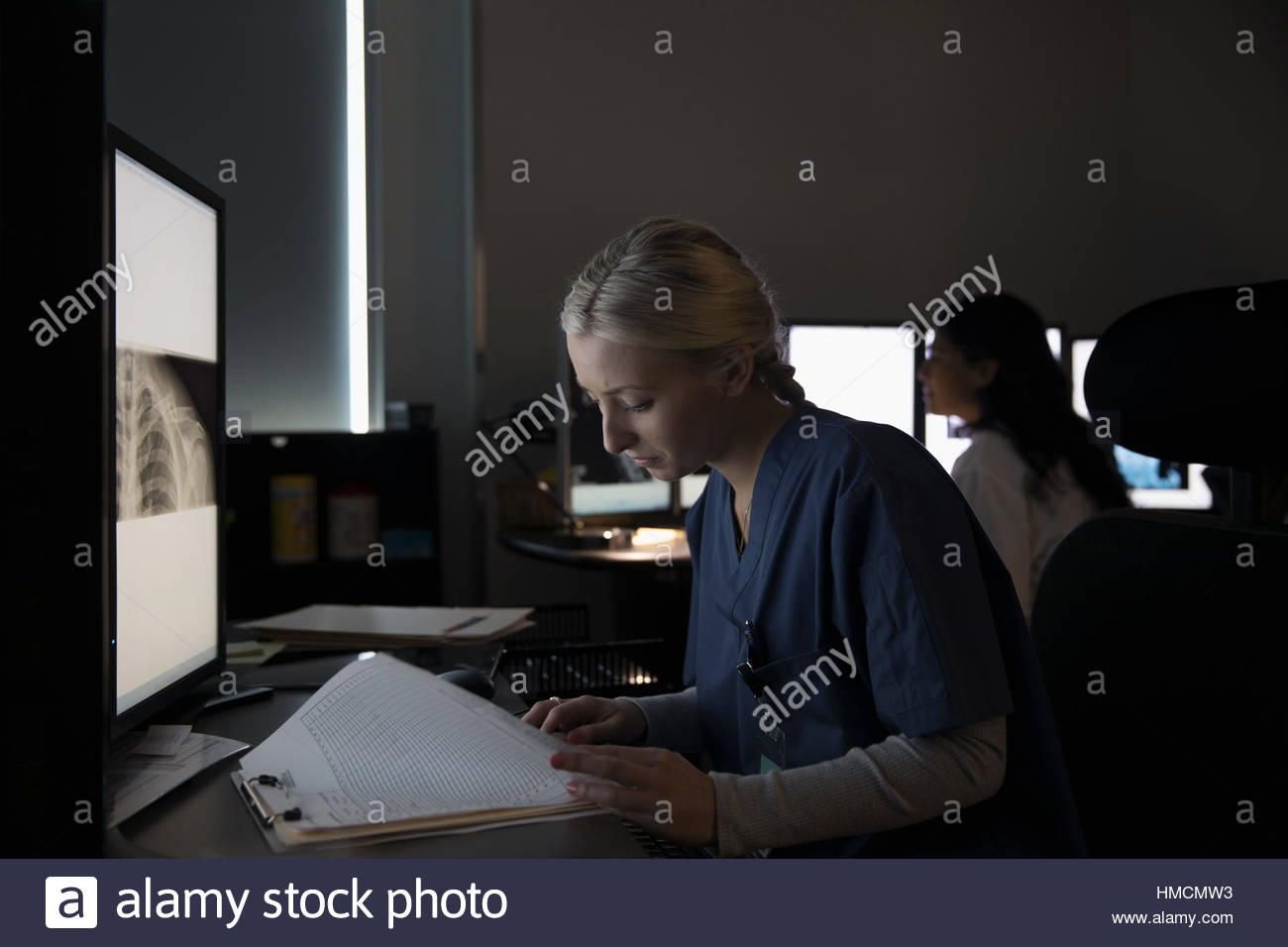 Young nurse on computer hi-res stock photography and images - Alamy