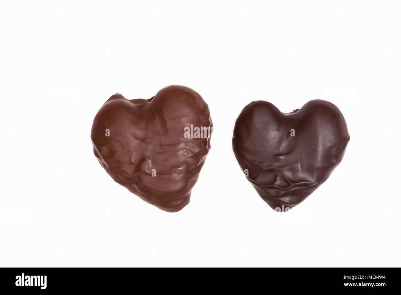 Two heart shaped Chocolates - one milk chocolate the other dark ...