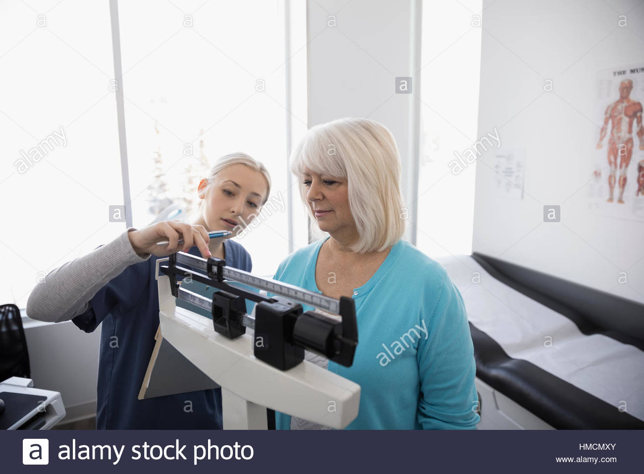 Nurse weighing patient clinic hi-res stock photography and images - Alamy