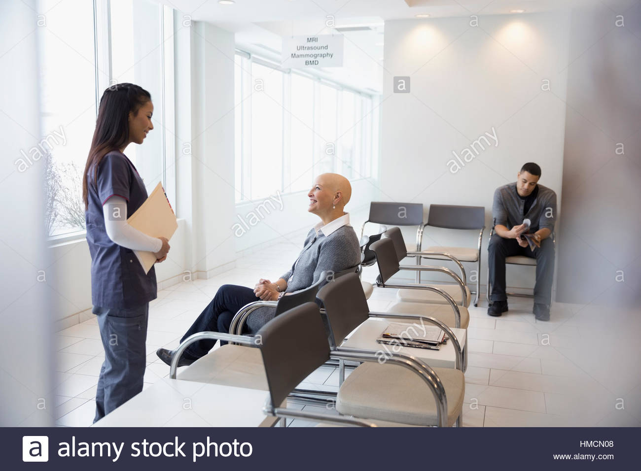 Nurse greeting patient hi-res stock photography and images - Alamy