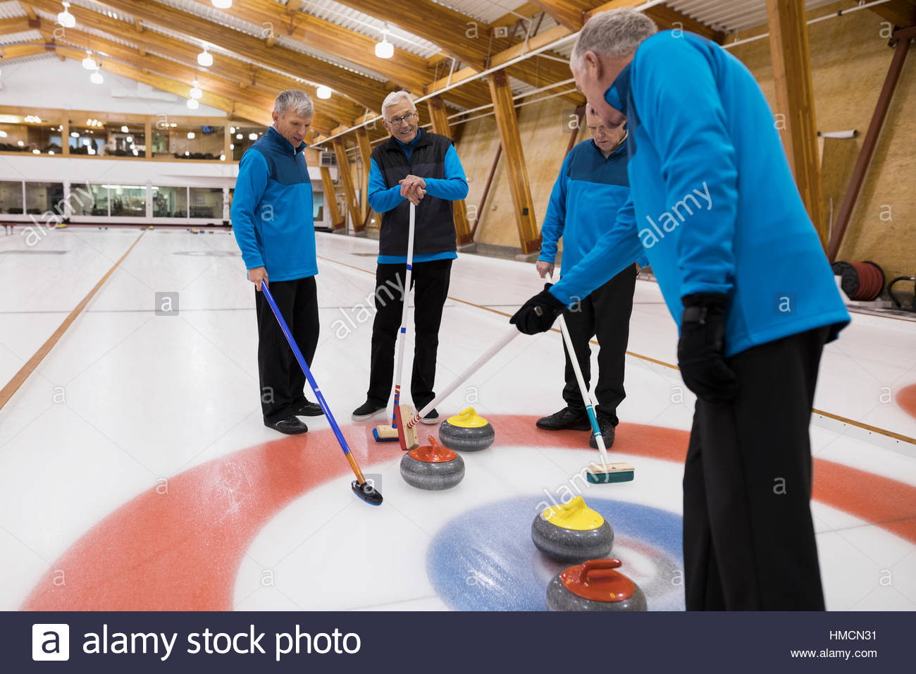 Senior men curling Stock Photo - Alamy