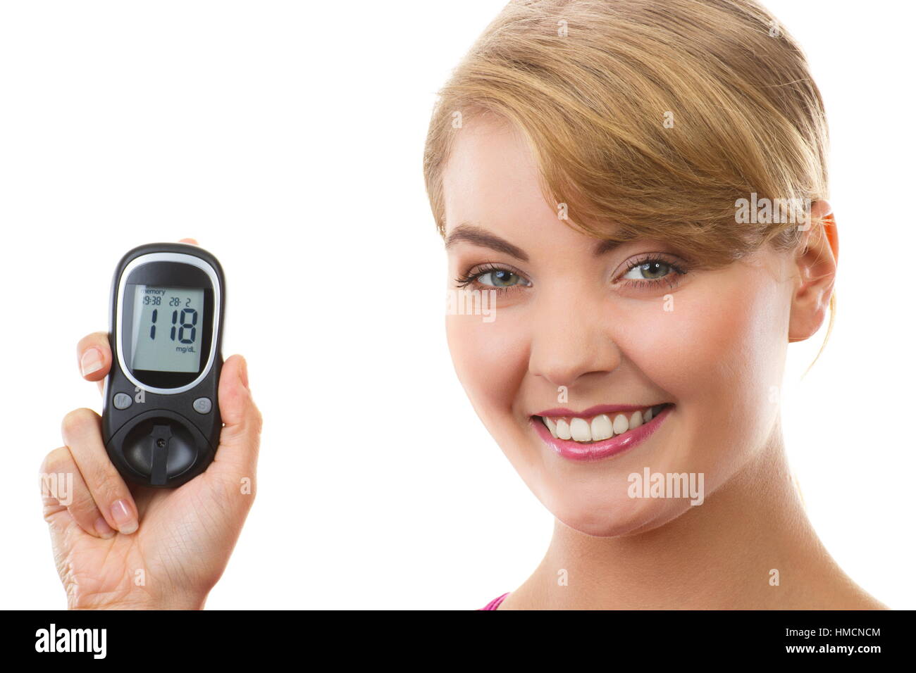 Happy woman holding glucose meter with positive result of measurement ...