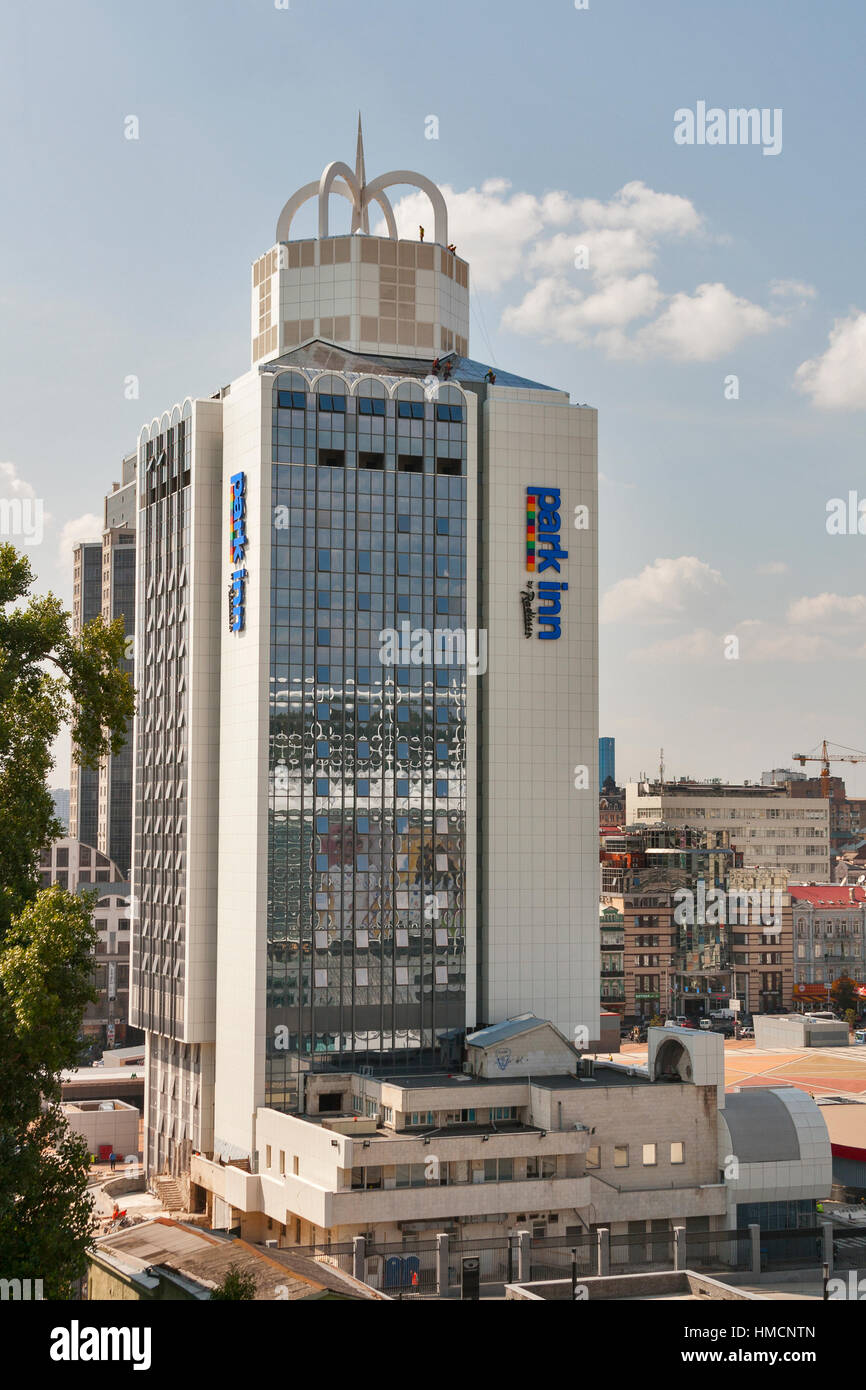 KIEV, UKRAINE - AUGUST 07: Workers are working on the roof of Hotel ...