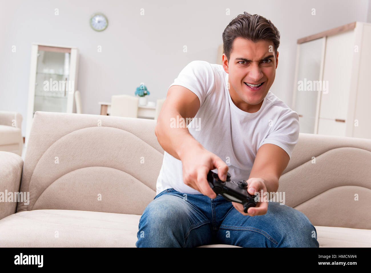 Man addicted to computer games Stock Photo - Alamy