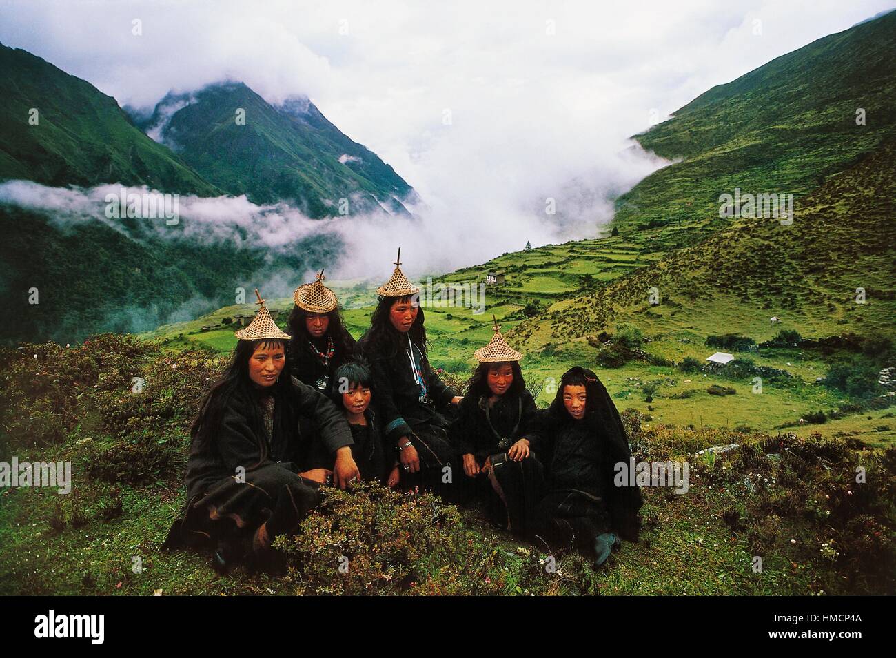 Group of Layap women wearing pointy hats, Jari-la, Bhutan Stock Photo ...