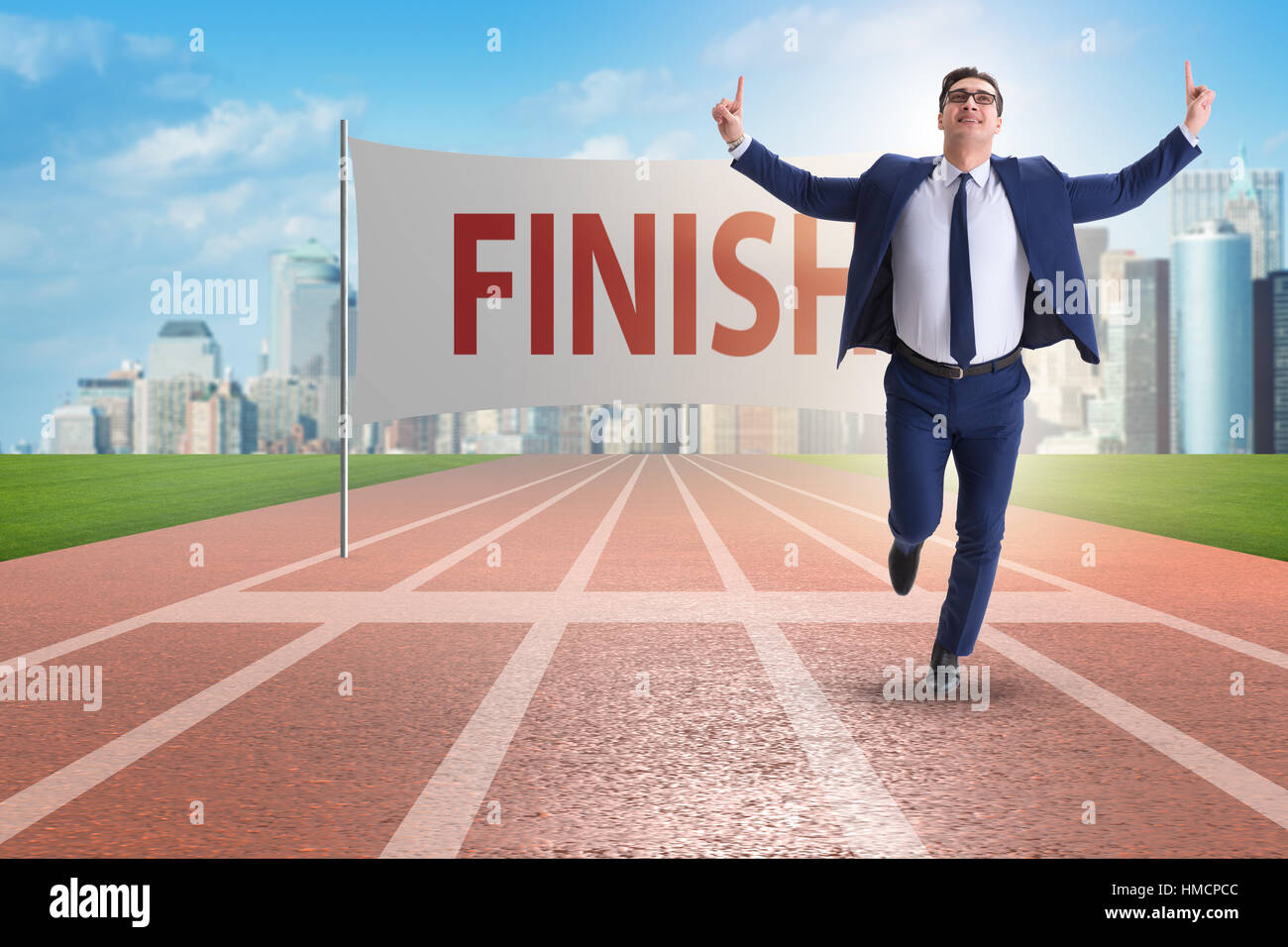 Businessman on the finishing line in competition concept Stock Photo ...
