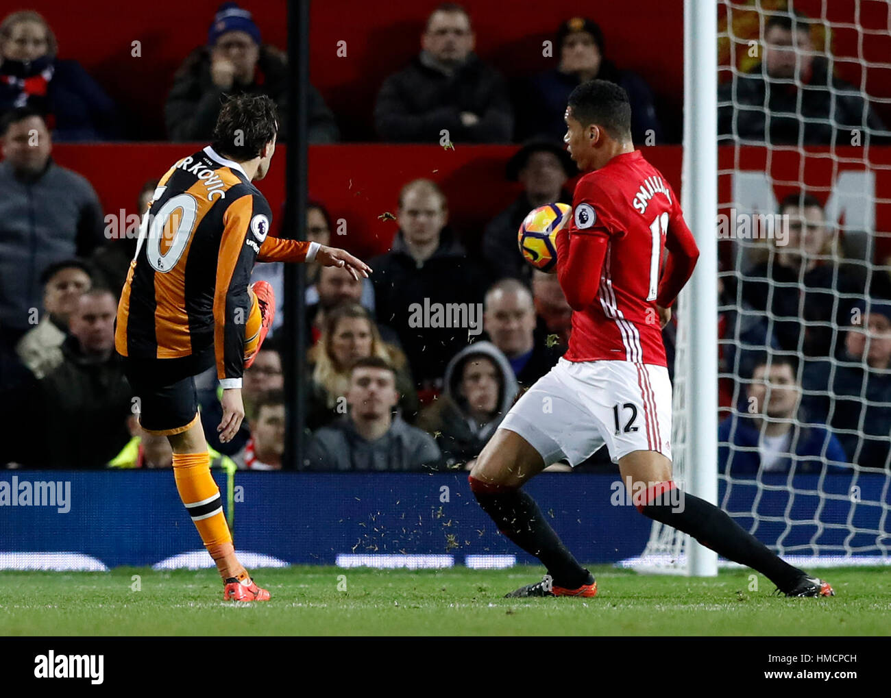 Hull City's Lazar Markovic (left) has a shot blocked by Manchester ...
