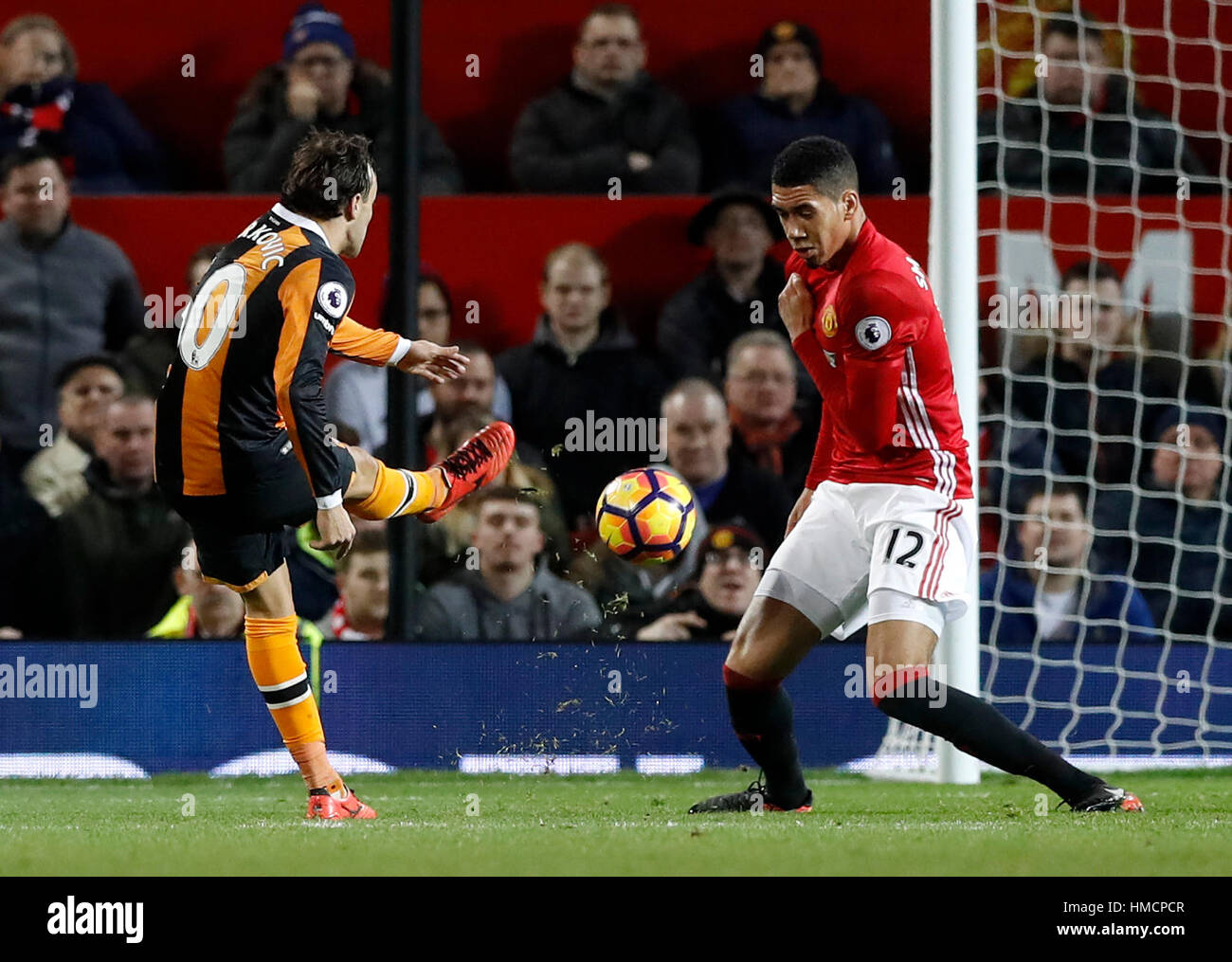 Hull City's Lazar Markovic (left) has a shot blocked by Manchester ...