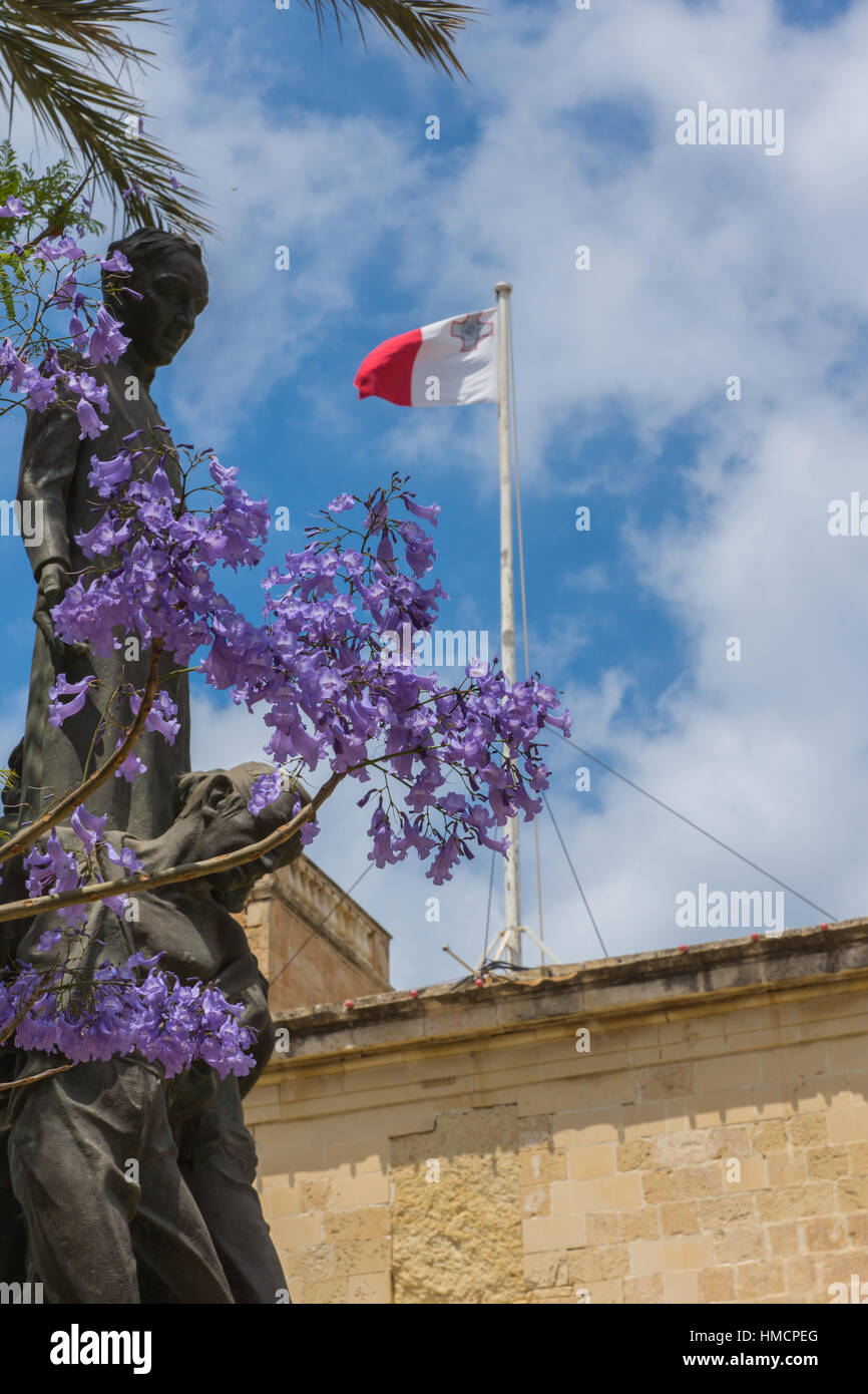Maltese flag waving on top of an official government building in ...
