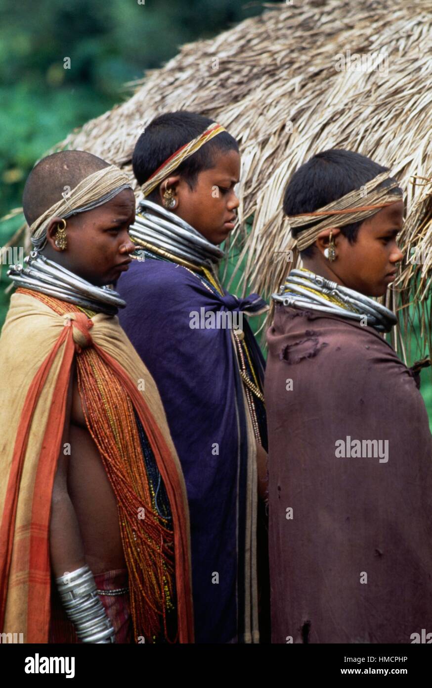 Boys with typical hairstyles wearing draped clothes, Gonda, Orissa ...