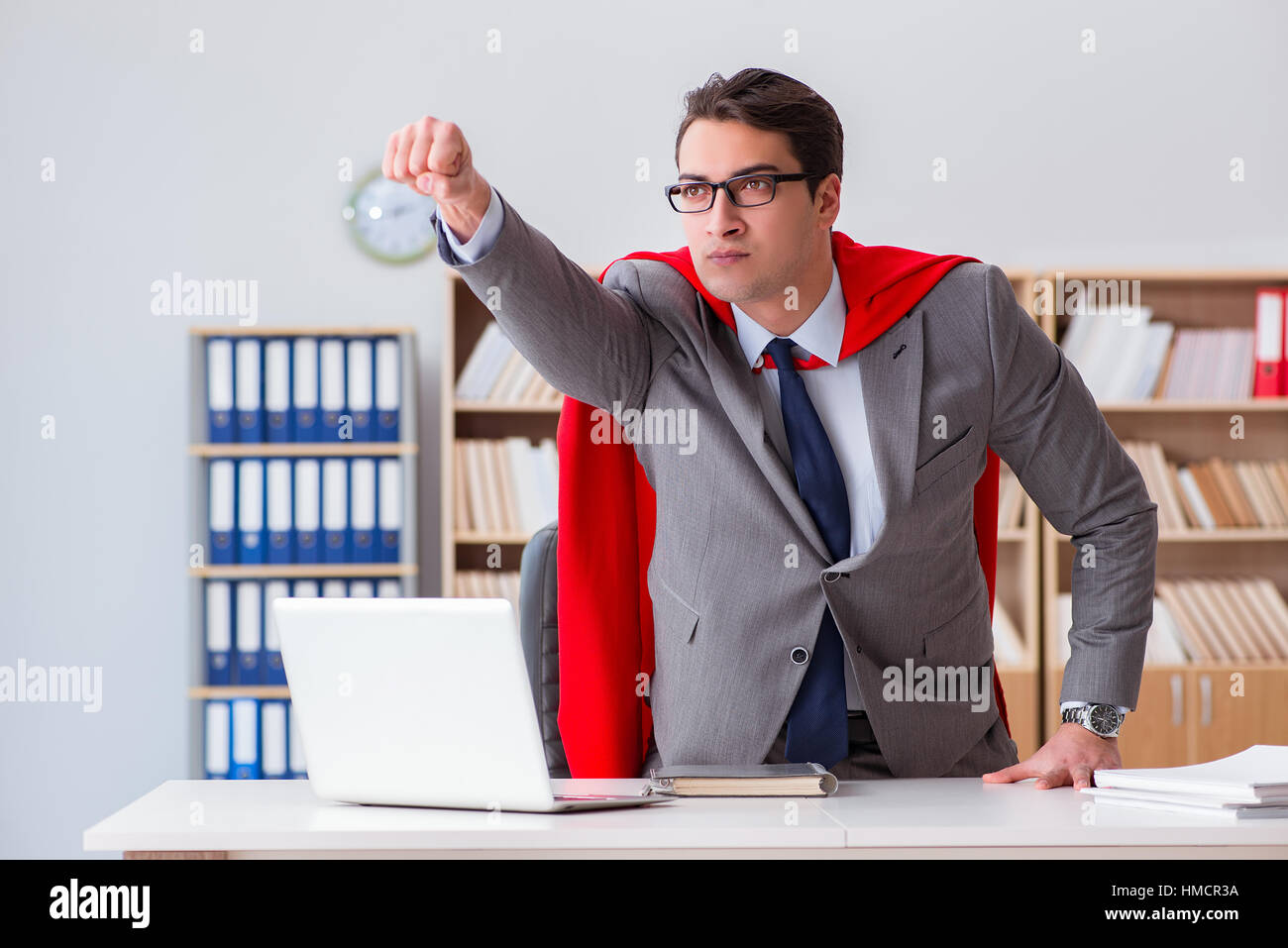 Superhero businessman working in the office Stock Photo - Alamy