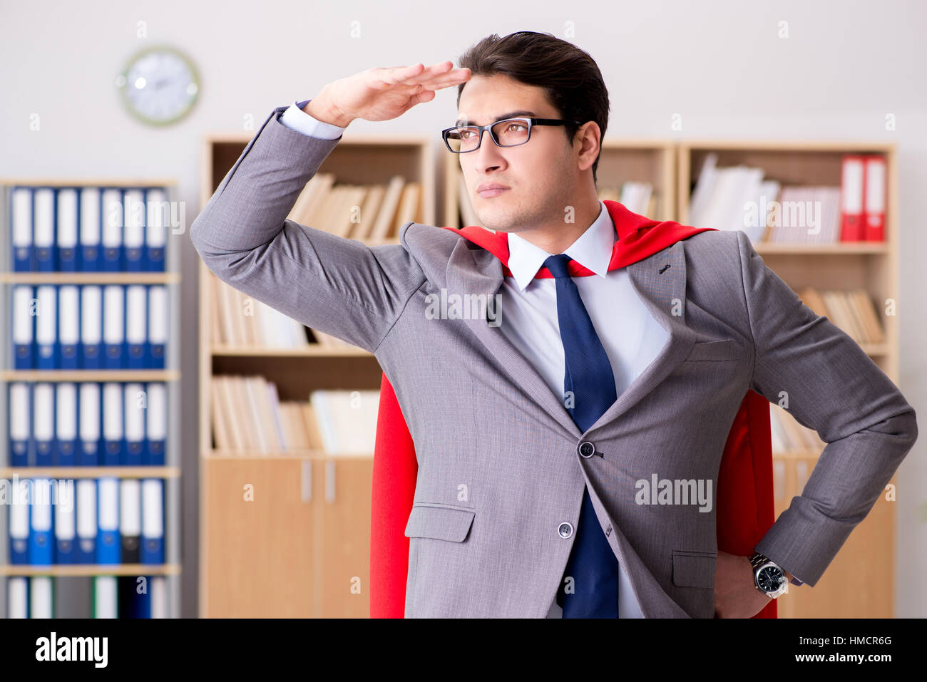 Superhero businessman working in the office Stock Photo - Alamy