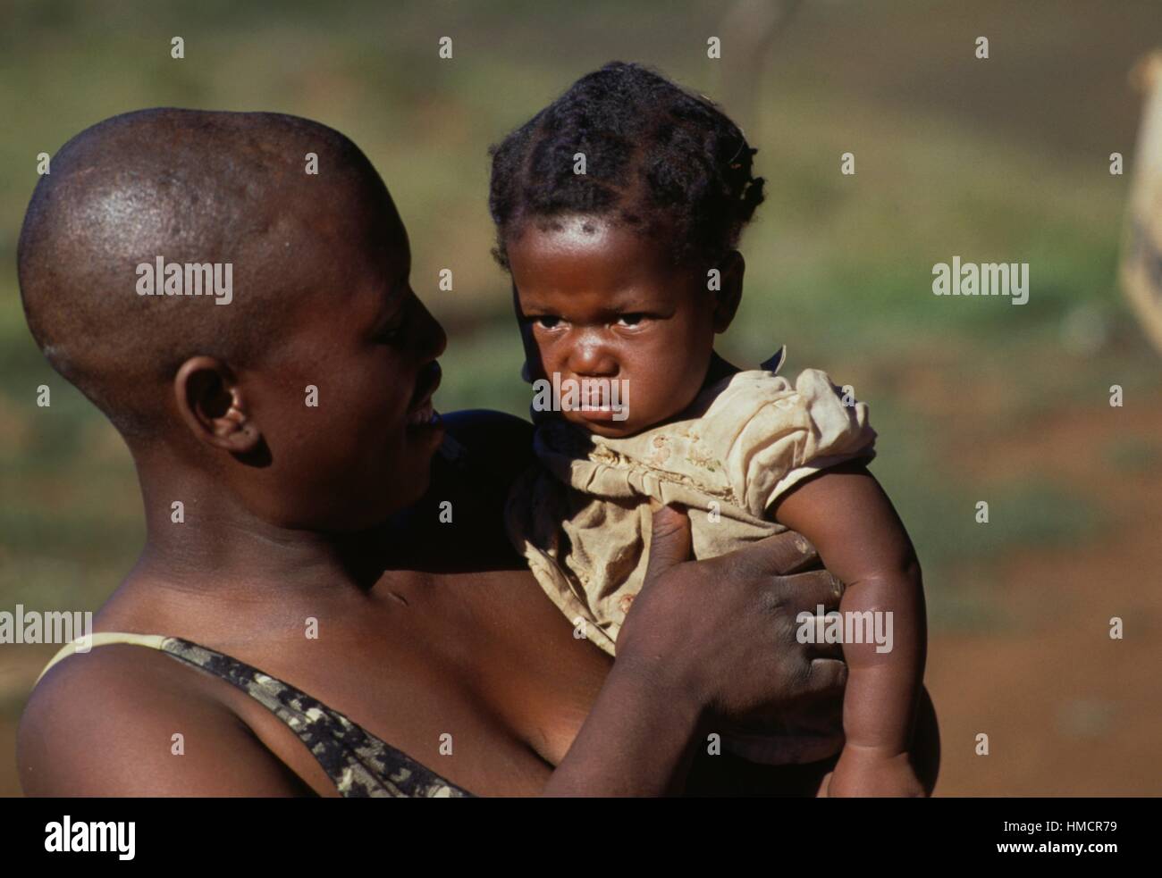 Basotho woman holding a child in her arms, Lesotho Stock Photo - Alamy