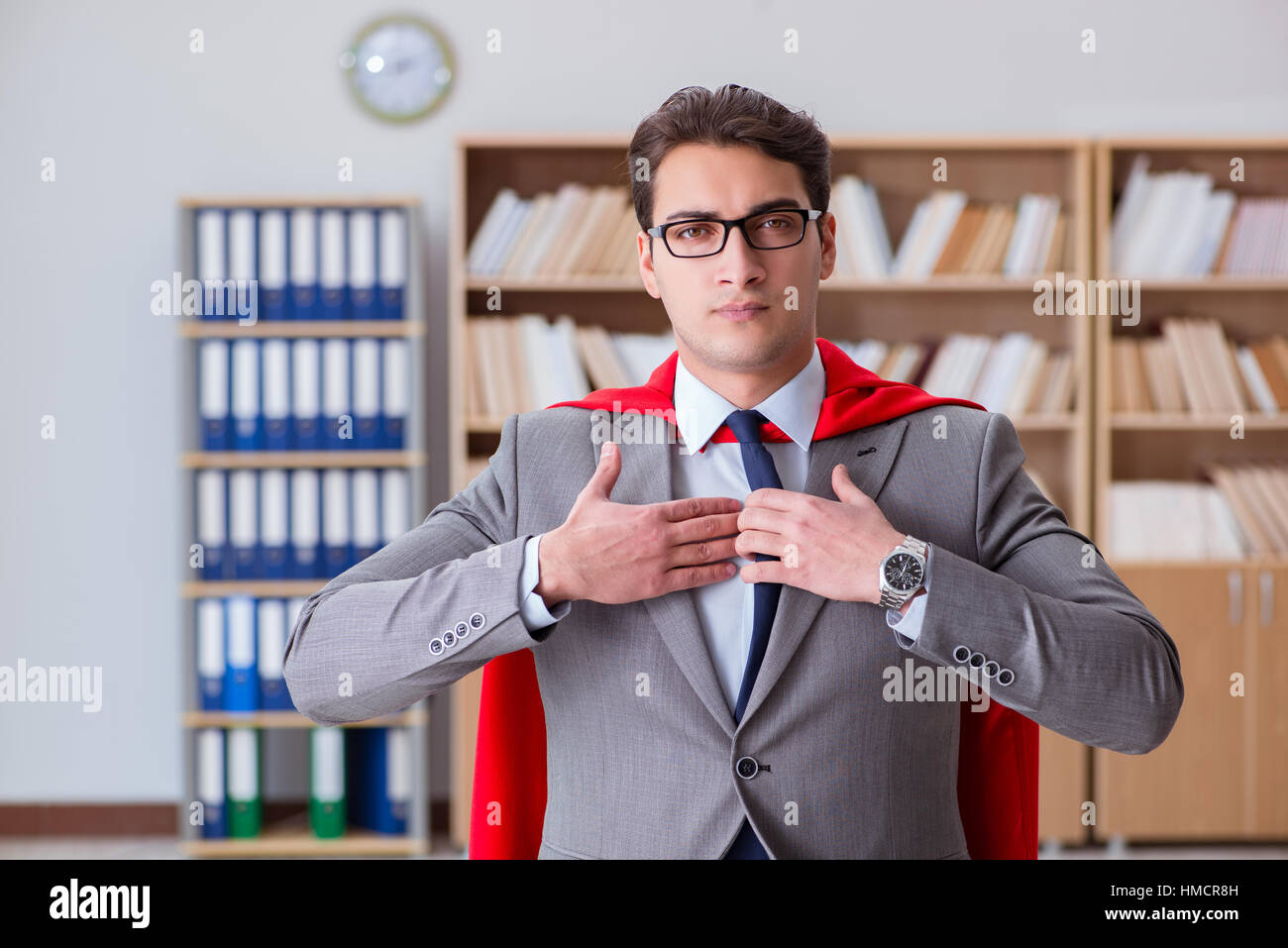 Superhero businessman working in the office Stock Photo - Alamy