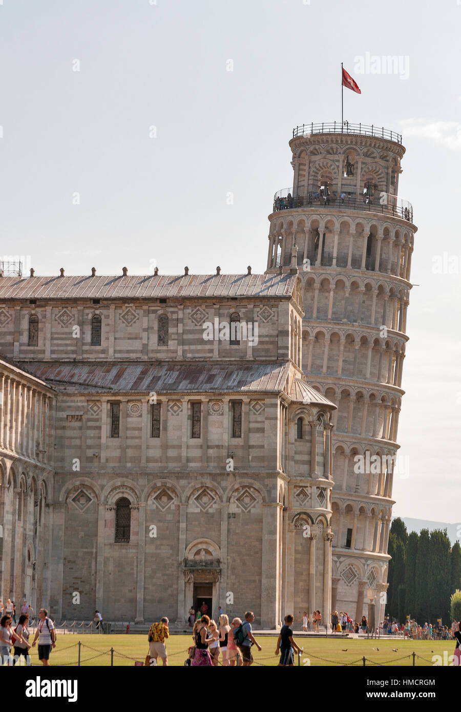 PISA, ITALY - SEPTEMBER 04, 2014: Tourists walk and posing in front of ...