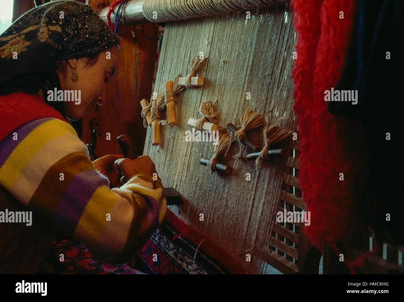 Young woman weaving carpet hi-res stock photography and images - Alamy