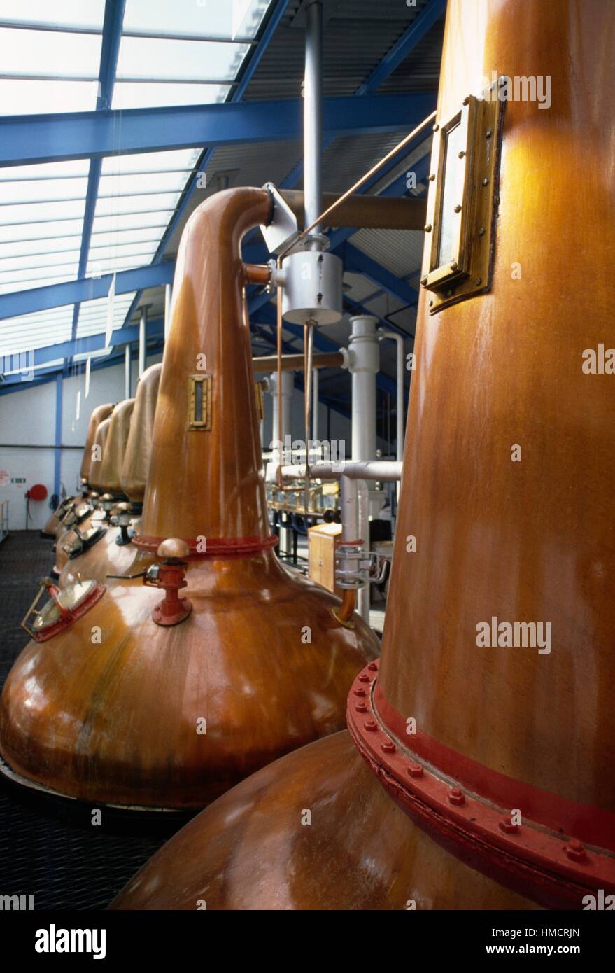 Copper pot still in a whiskey distillery, Hebrides, United Kingdom ...
