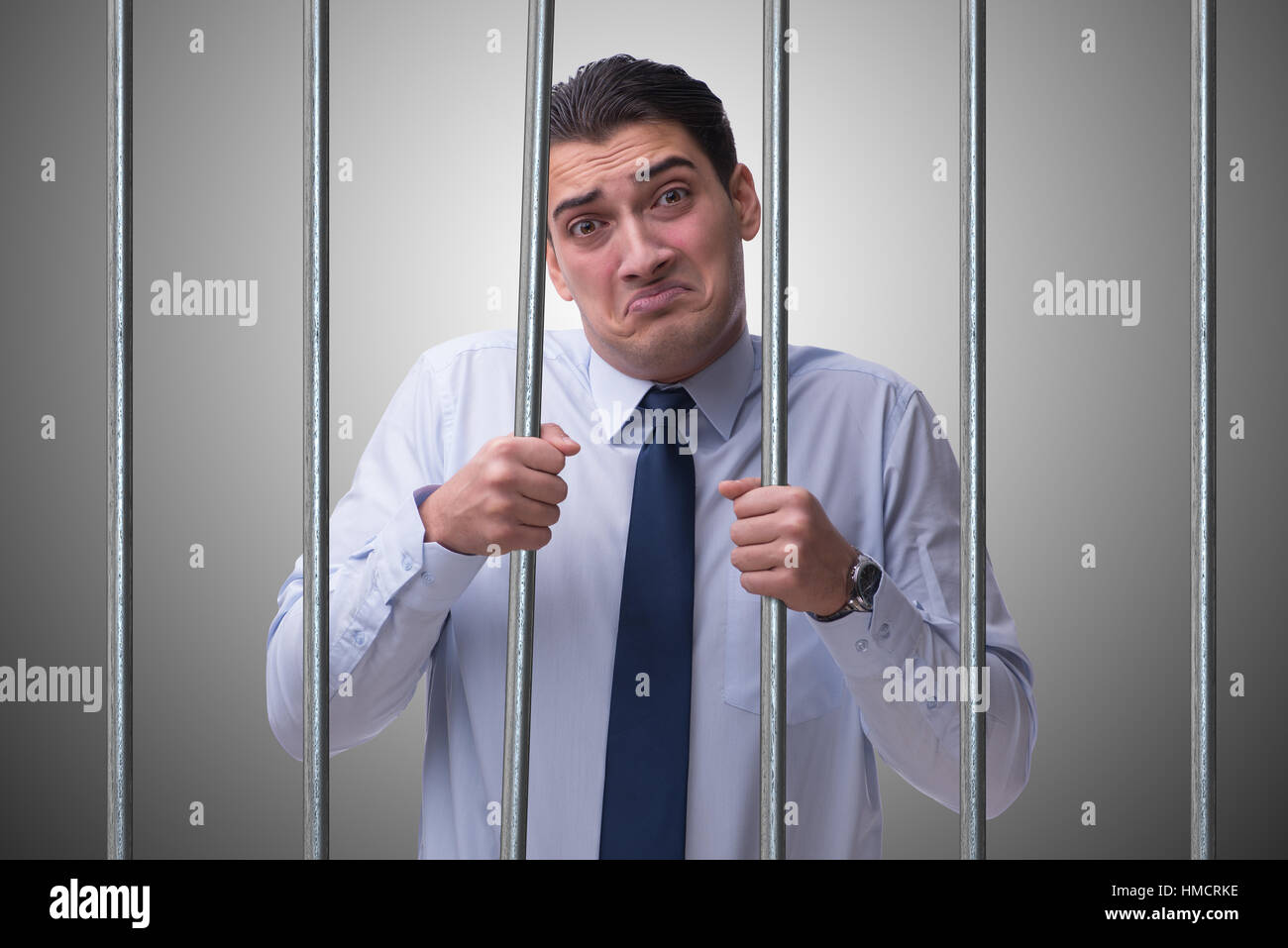 Prisoner in handcuffs behind bars hi-res stock photography and images ...
