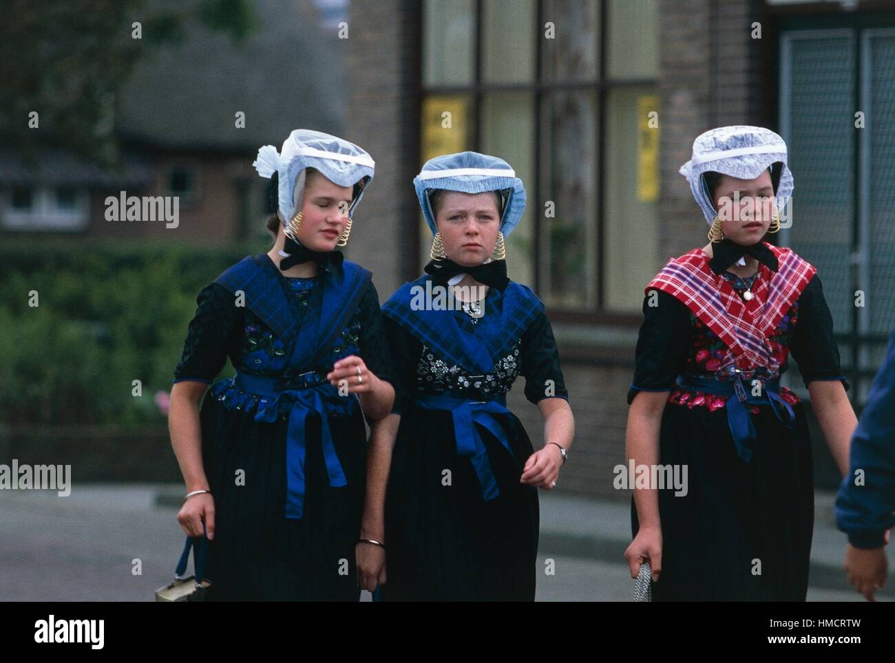 Calvinist girls in traditional clothes on their way to Sunday Mass ...