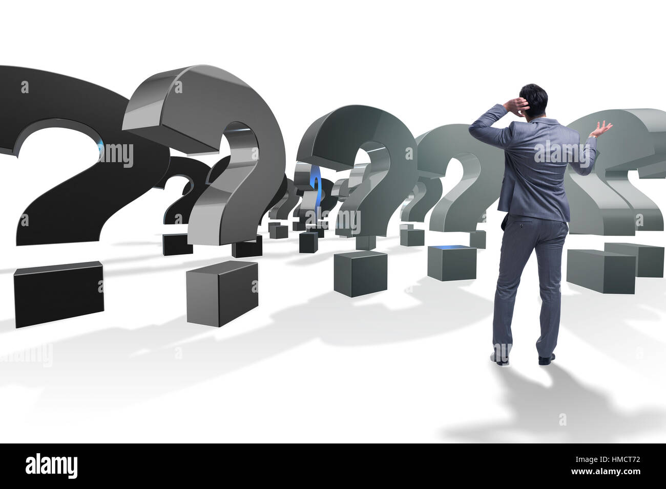Businessman in uncertainty concept with question marks Stock Photo - Alamy