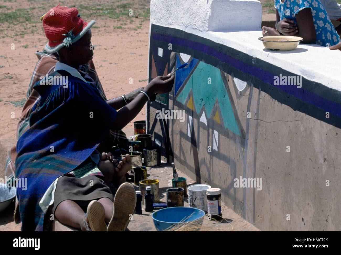 Ndebele woman painting a mural hi-res stock photography and images - Alamy
