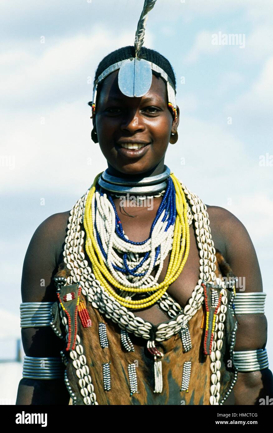 Hamar woman wearing a characteristic oval-shaped metal plate called a ...