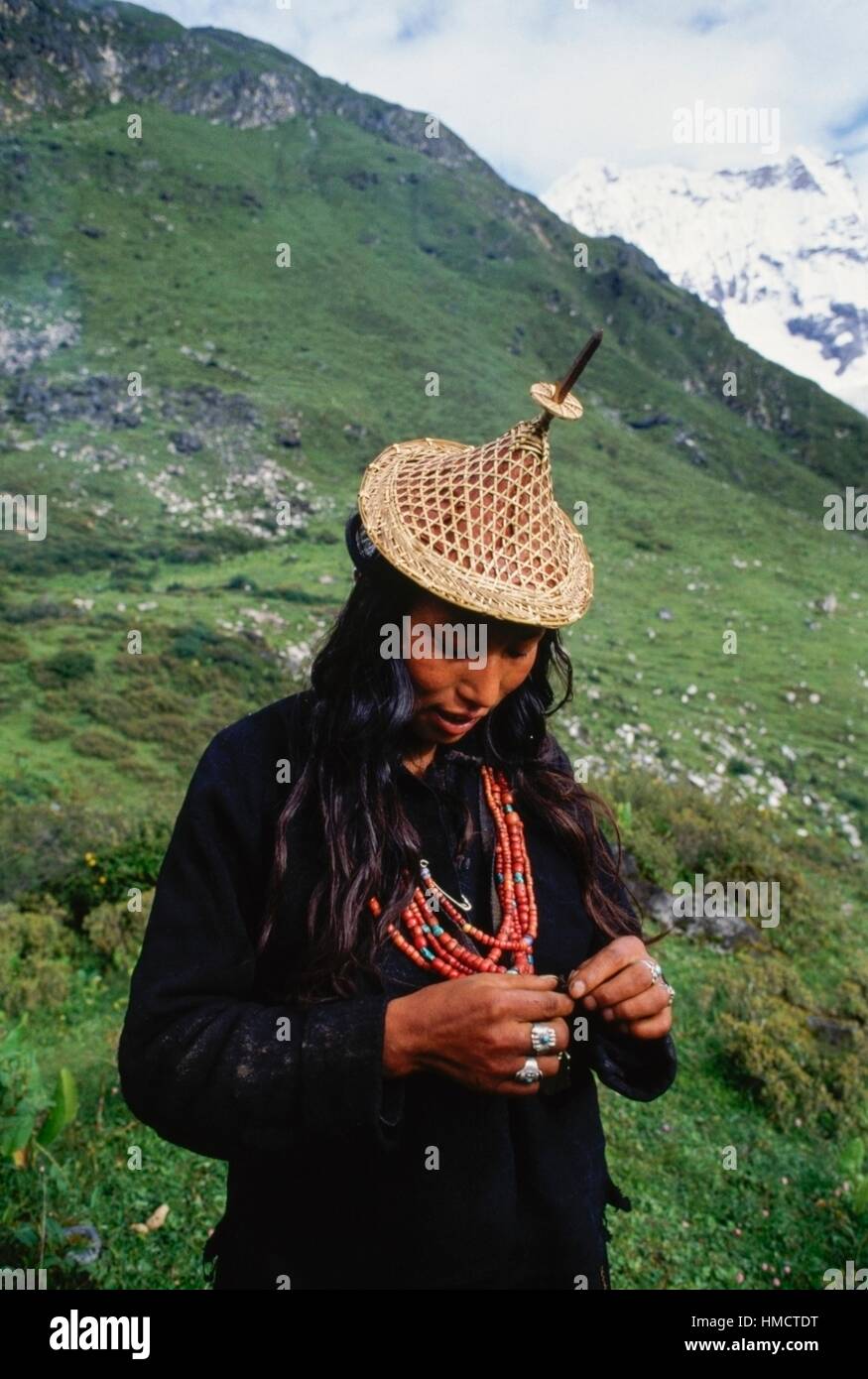 Layap woman with traditional pointed hat and necklaces, Jari-la, Bhutan ...