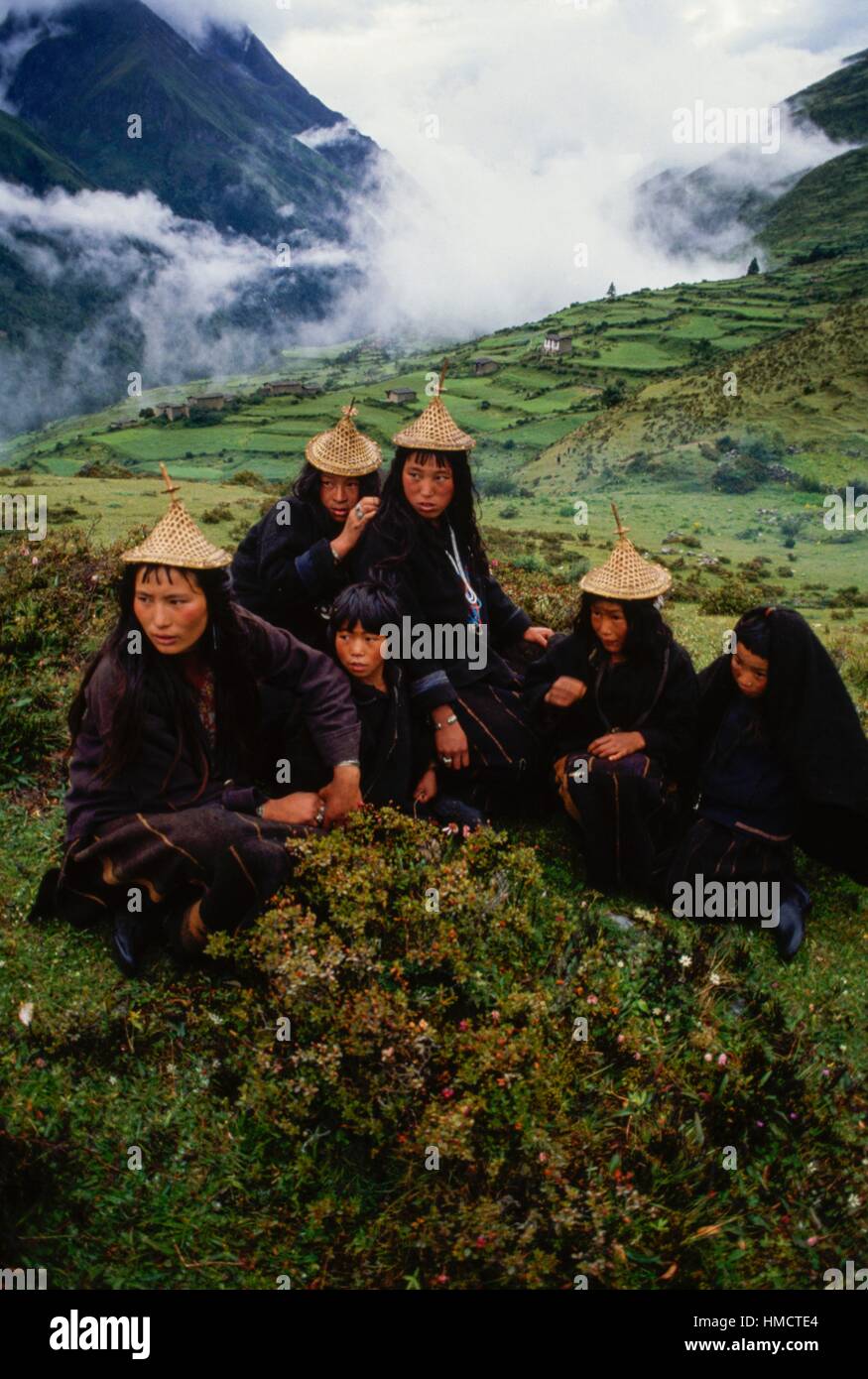 Group of Layap women wearing pointy hats, Jari-la, Bhutan Stock Photo ...