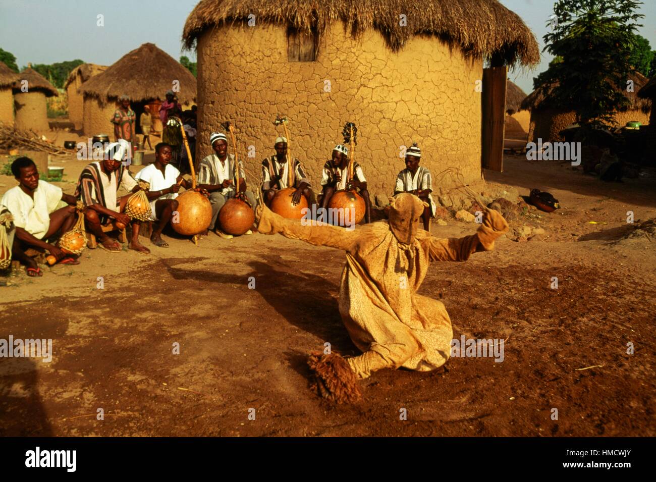 Men performing the panther dance, and men playing musical instruments ...