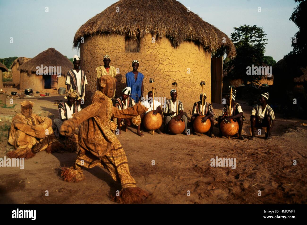 Men performing the panther dance, and men playing musical instruments ...