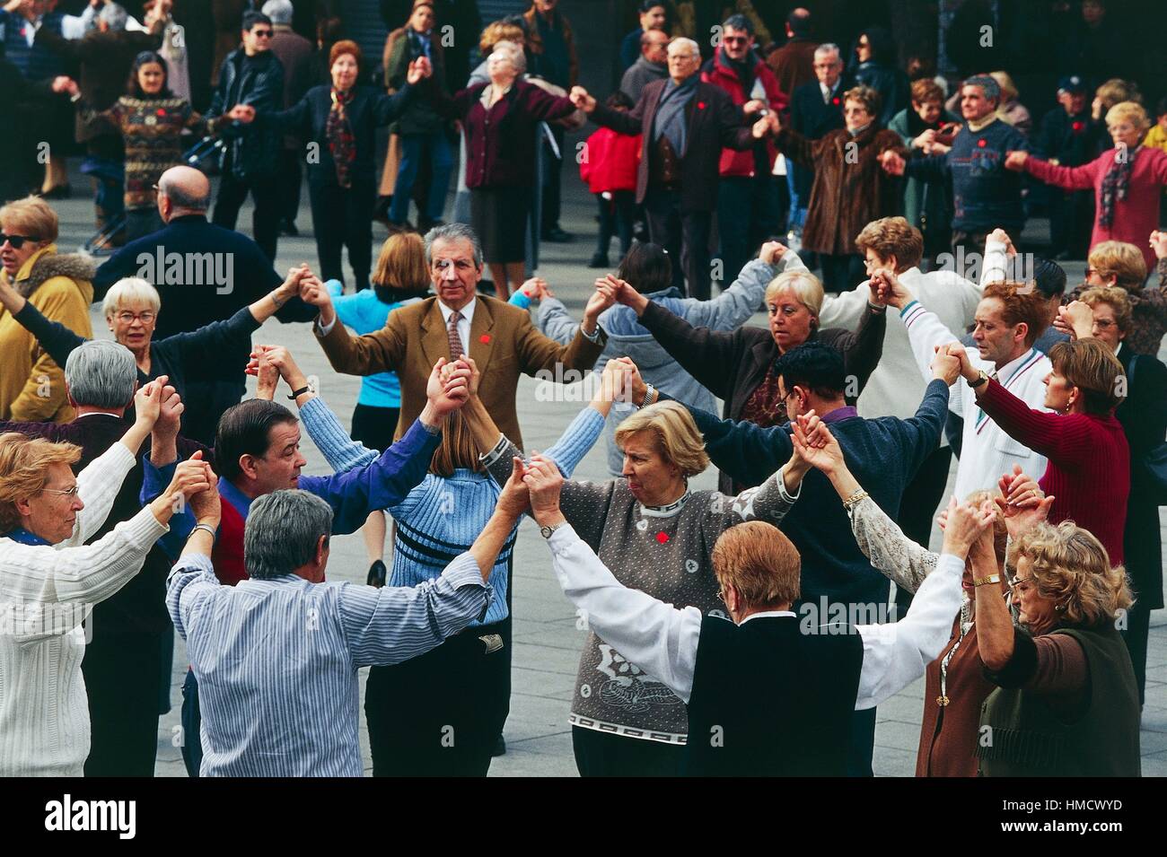 Men and women dancing the Sardana, Catalan folk dance in front of the ...